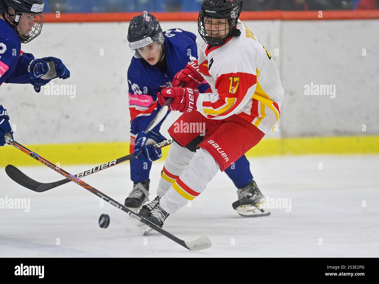 Boyu Tian of China plays the puck during the 2025 Ice Hockey U20 World Championship Division II ...