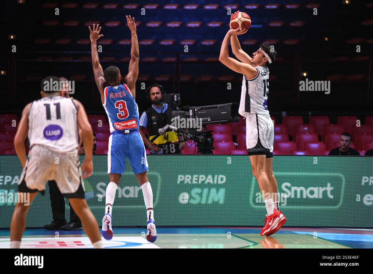 Patrick Gardner (Egypt) shooting over Jean Montero (Dominican Republic). FIBA Olympic Qualifying ...