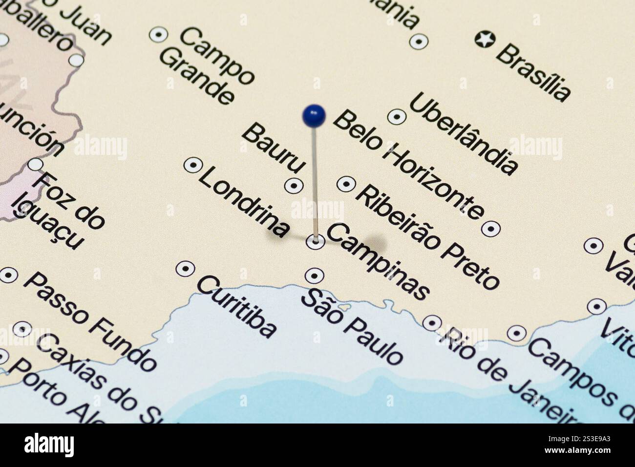 Macro photo of a blue pin needle into campinas city of brazil political ...