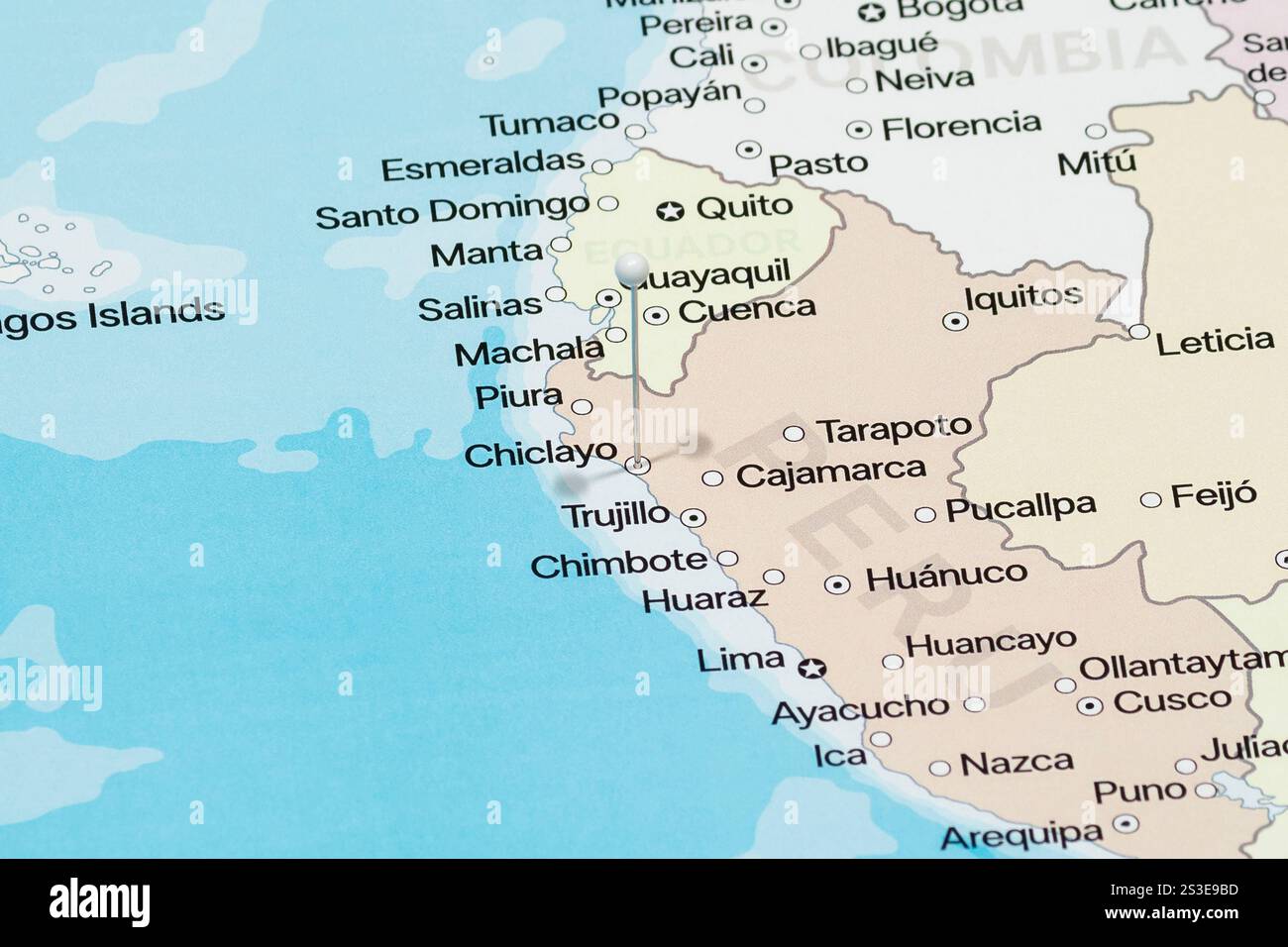 Macro photo of a white pin needle into Chiclayo city of Peru political ...