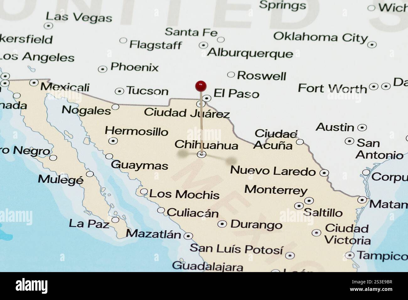 Macro photo of a red pin needle into chihuahua city of Mexico political ...