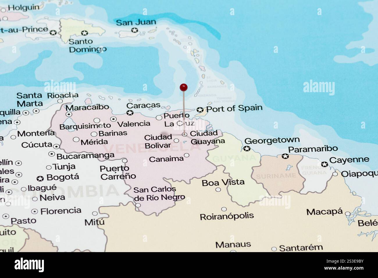 Macro photo of a red pin needle into Ciudad Guayana city of Venezuela ...