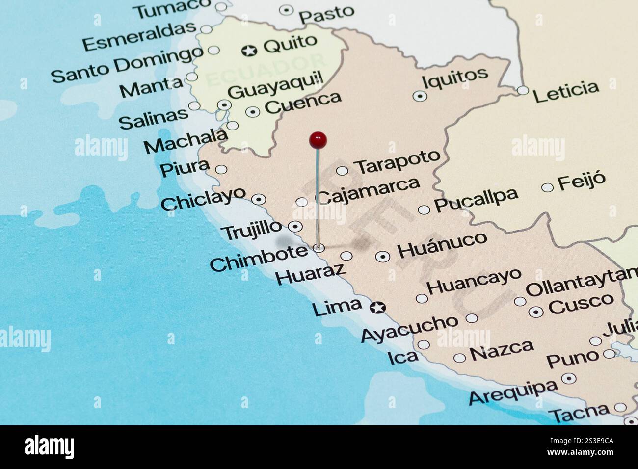 Macro photo of a red pin needle into Chimbote city of Peru political ...