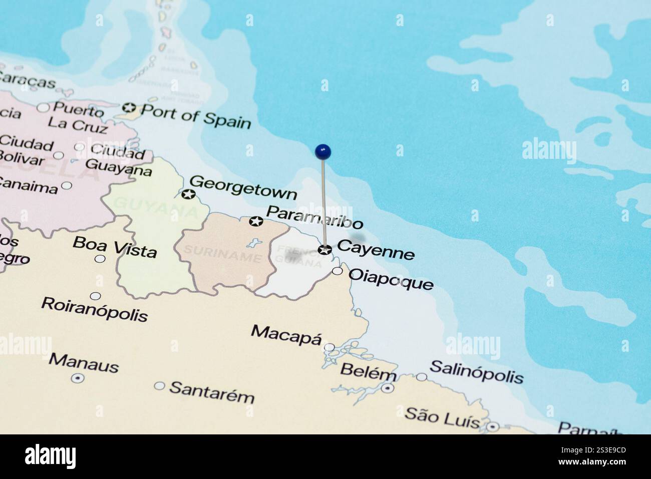 Macro photo of a blue pin needle into Cayenne city of French Guiana ...