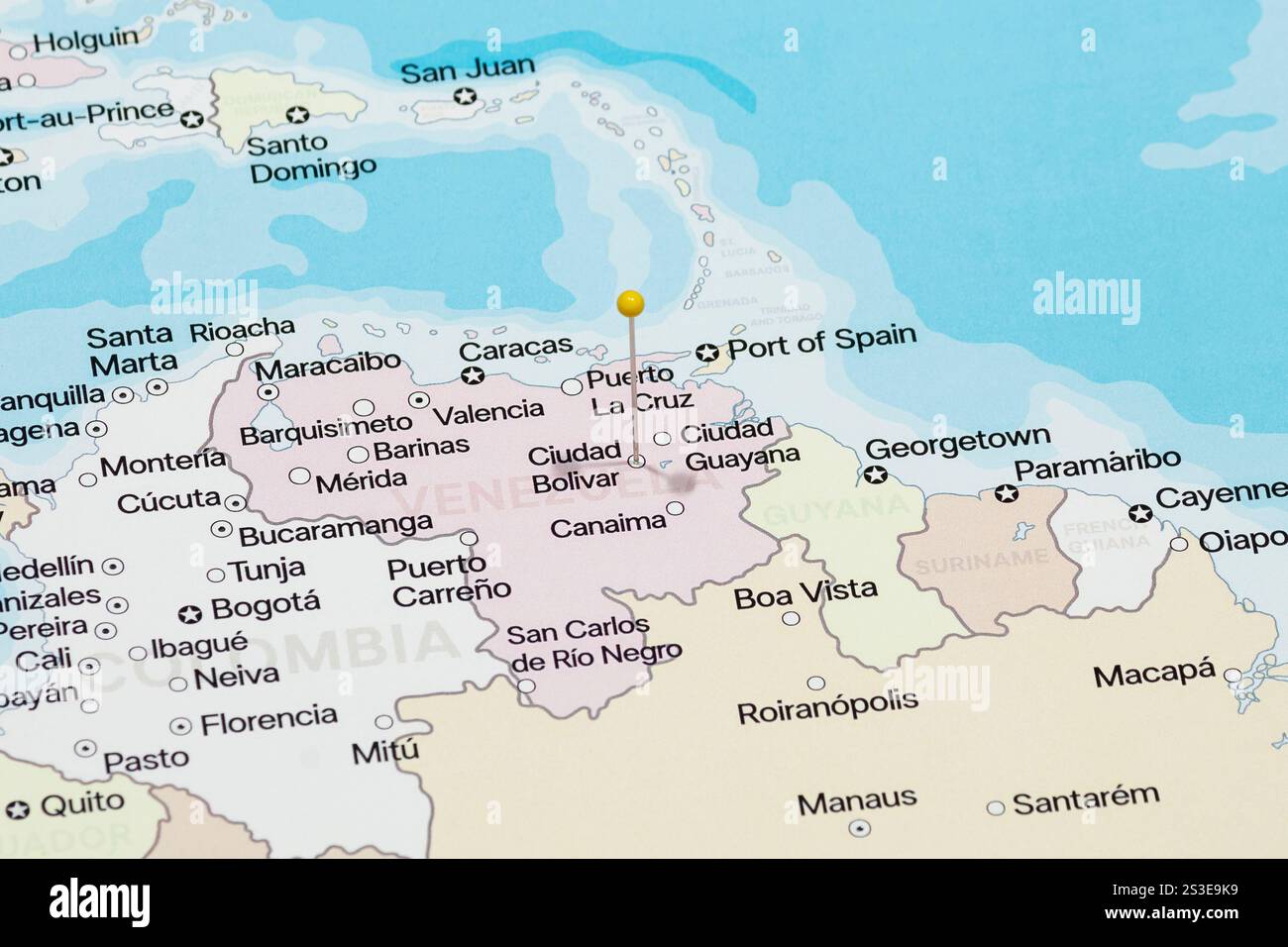 Macro photo of a yellow pin needle into Ciudad Bolivar city of ...