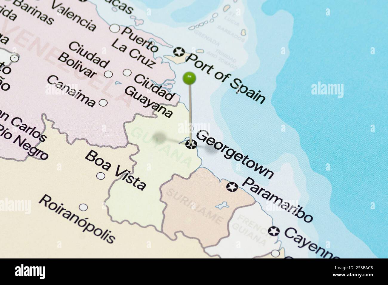 Macro photo of a green pin needle into Georgetown city of Guyana ...