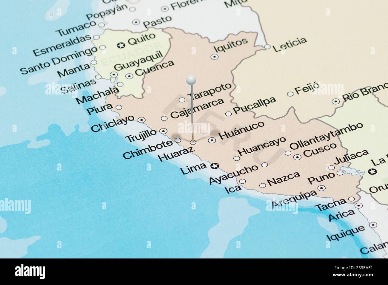 Macro photo of a white pin needle into Huaraz city of Peru political ...