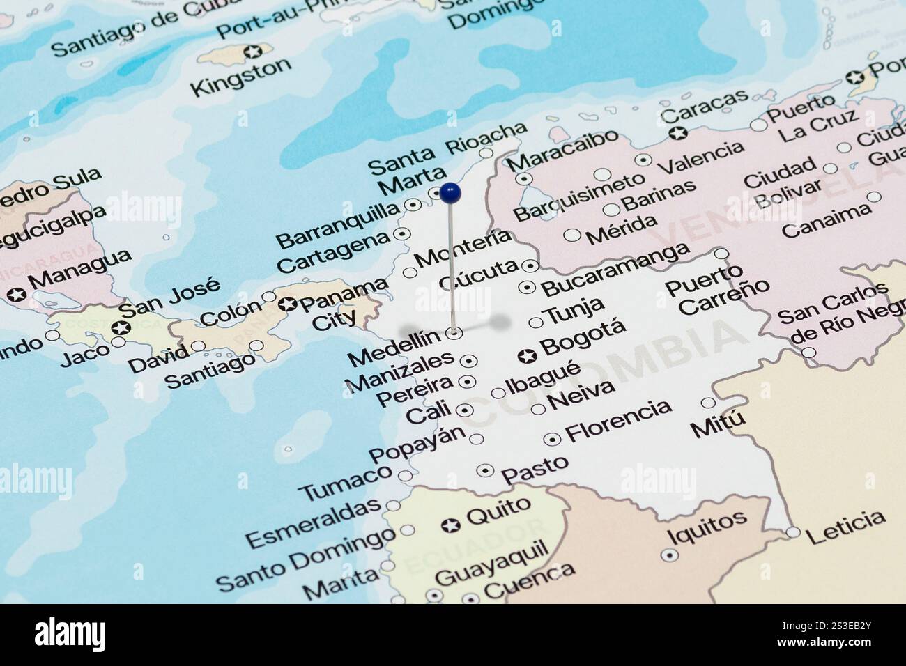 Macro photo of a blue pin needle into Medellin city of Colombia ...