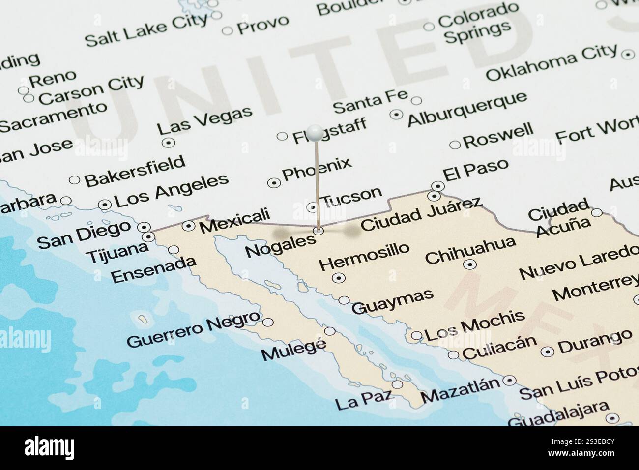 Macro photo of a white pin needle into Nogales city of Mexico political ...