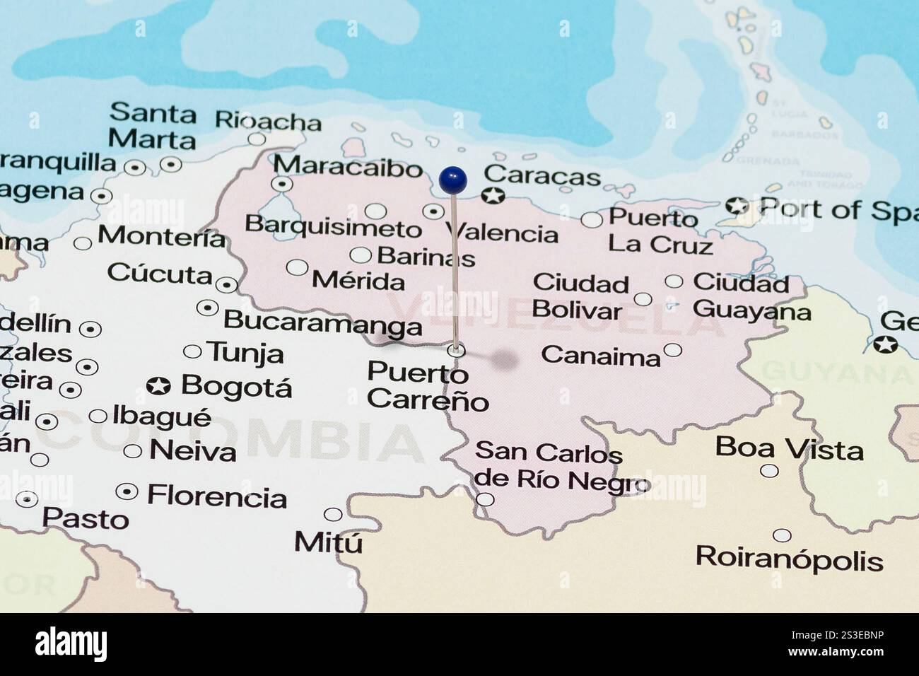 Macro photo of a blue pin needle into Puerto Carreno city of Colombia ...