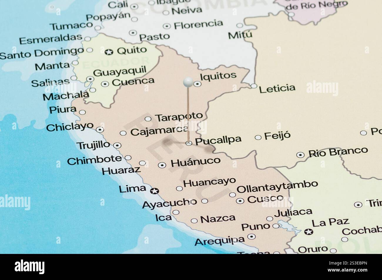 Macro photo of a white pin needle into Pucallpa city of Peru political ...