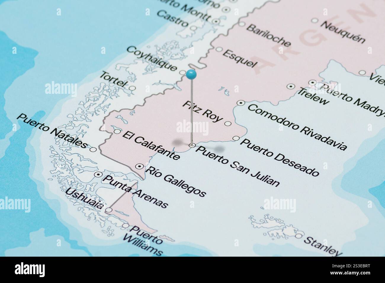 Macro photo of a light blue pin needle into Puerto San Julian city of ...