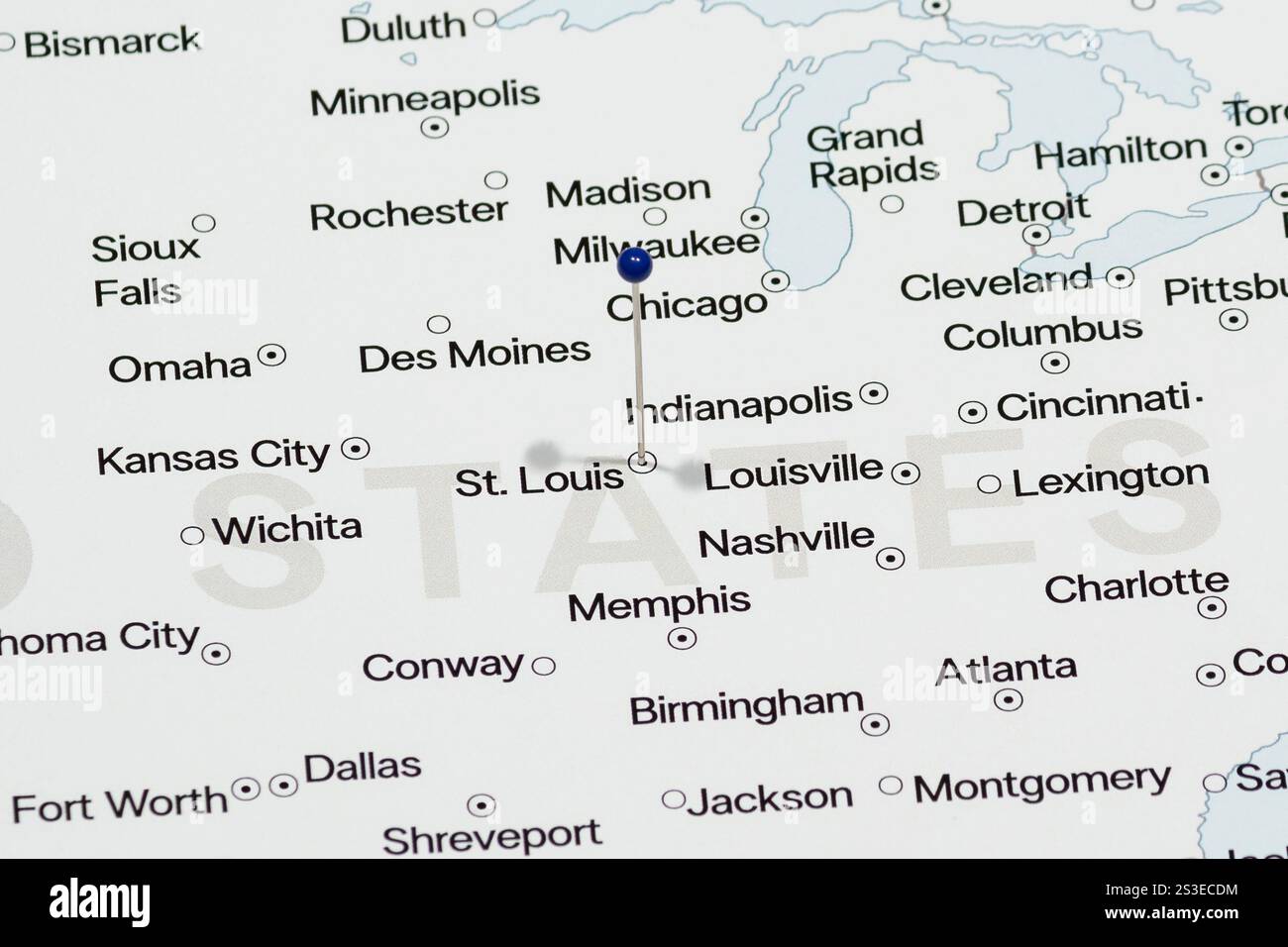 Macro photo of a blue pin needle into St. Louis city of United States ...
