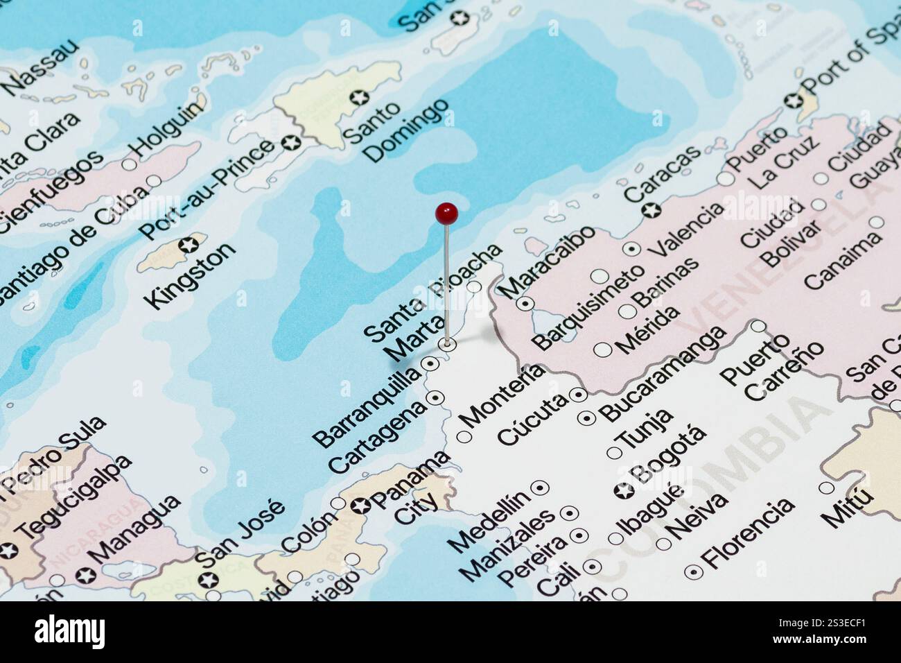 Macro photo of a red pin needle into Santa Marta city of Colombia ...