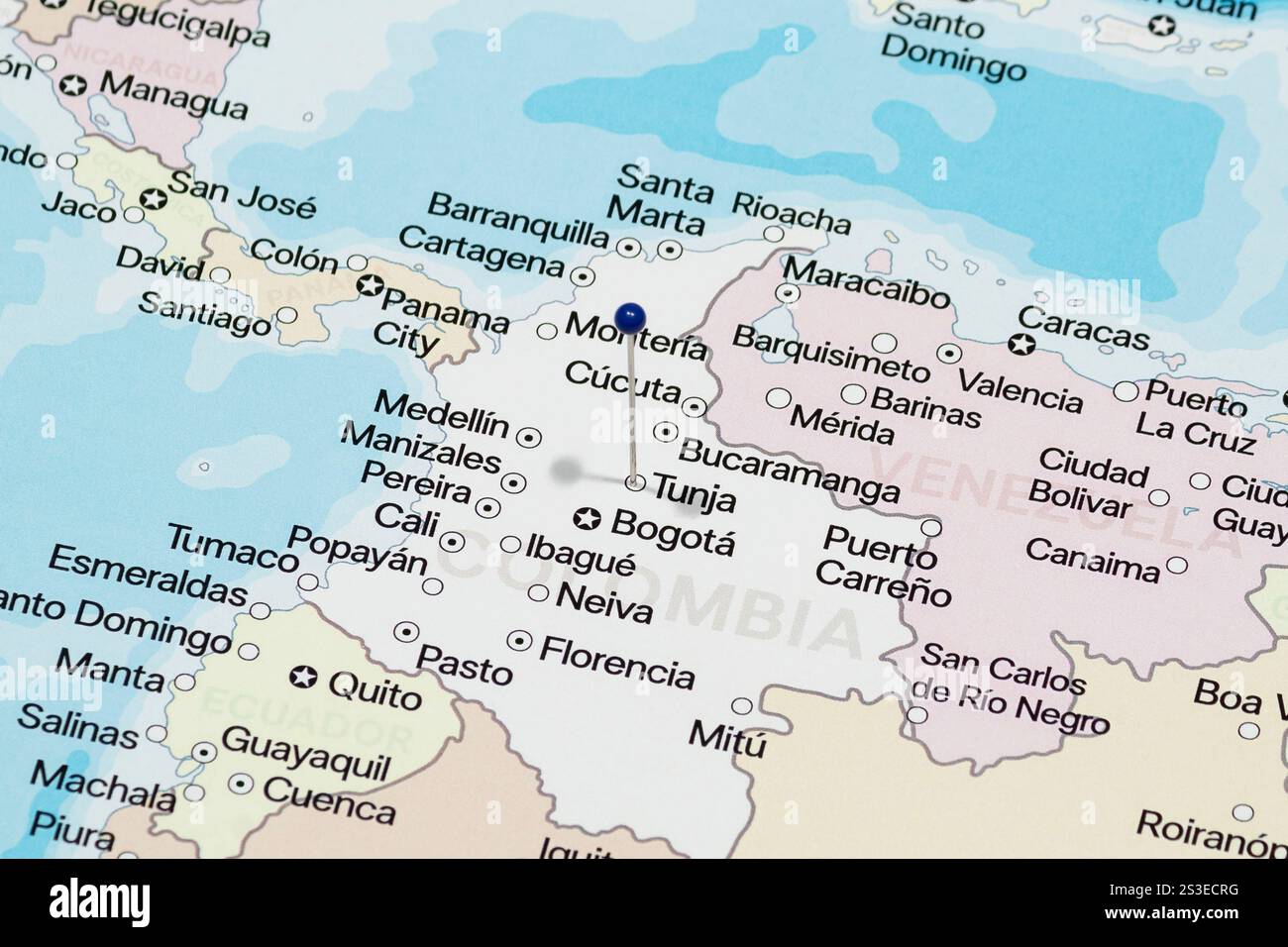 Macro photo of a blue pin needle into Tunja city of Colombia political ...