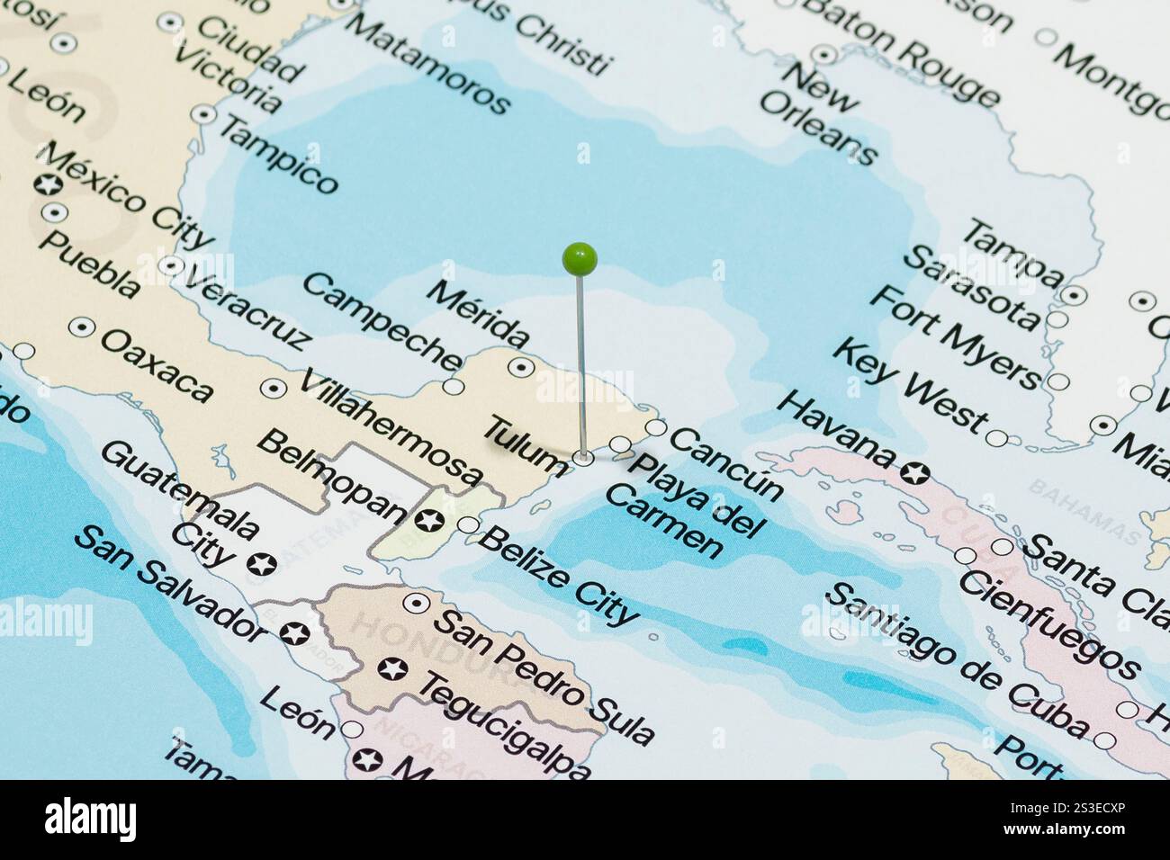 Macro photo of a green pin needle into Tulum city of Mexico political ...