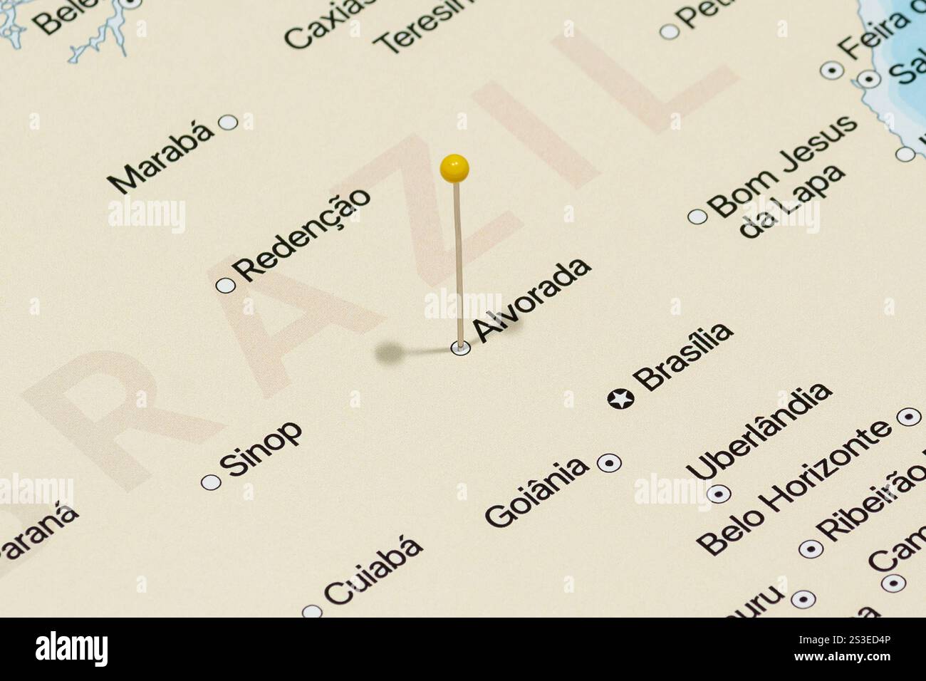 Macro photo of a green pin needle into Alvorada city of Brazil ...