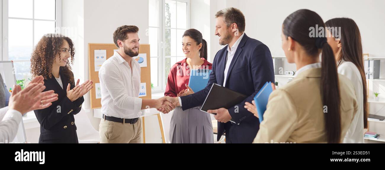 Happy proud male boss handshakes encouraging and thanking office ...