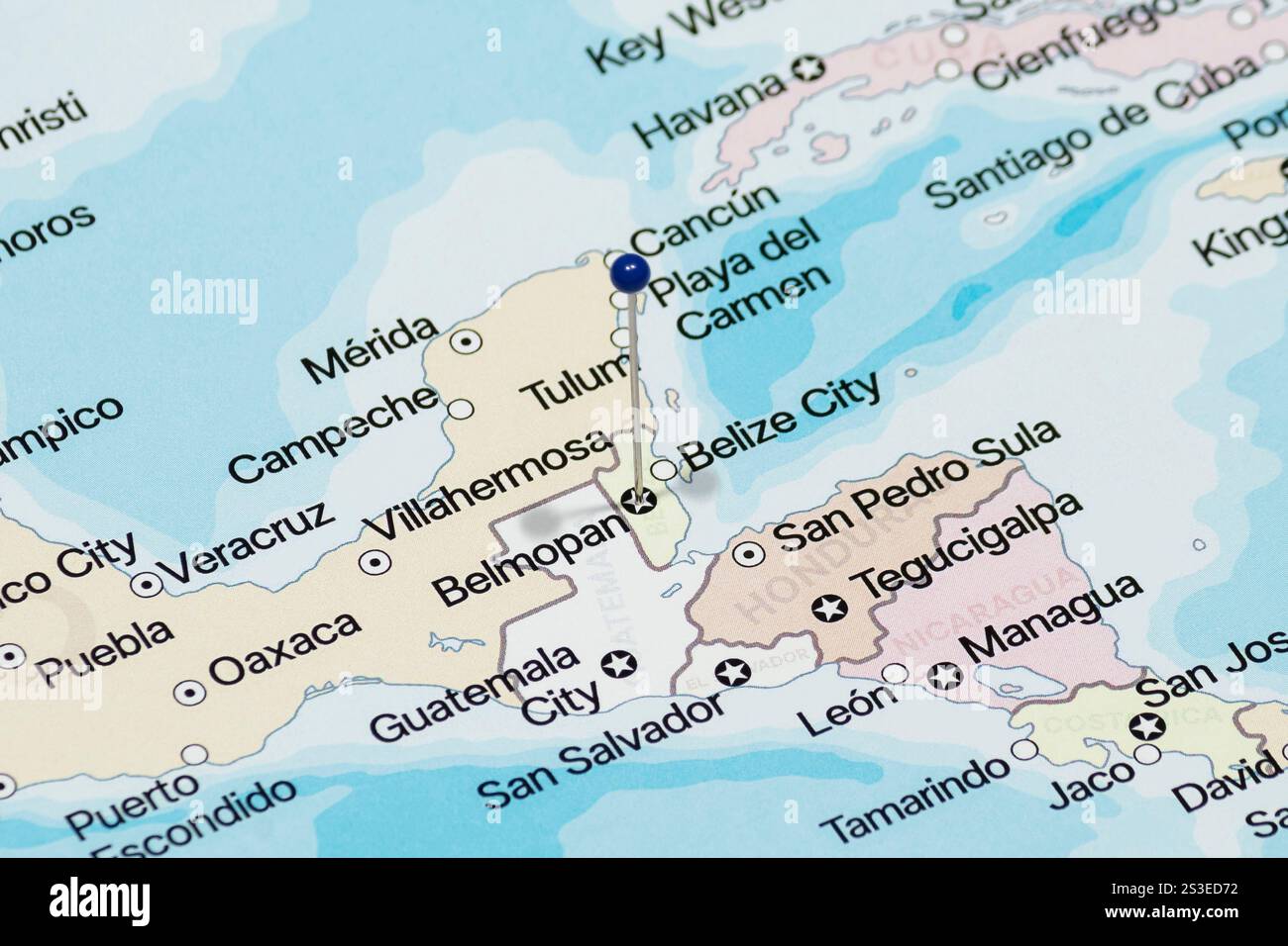 Macro photo of a blue pin needle into Belmopan city of Belize political ...