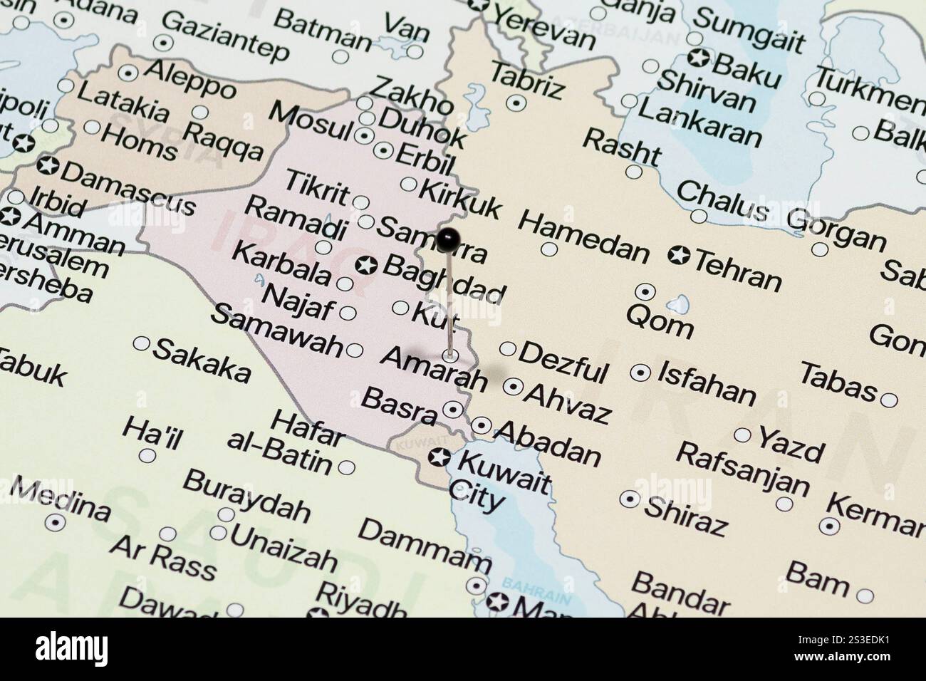 Macro photo of a black pin needle into Amarah city of Iraq political ...