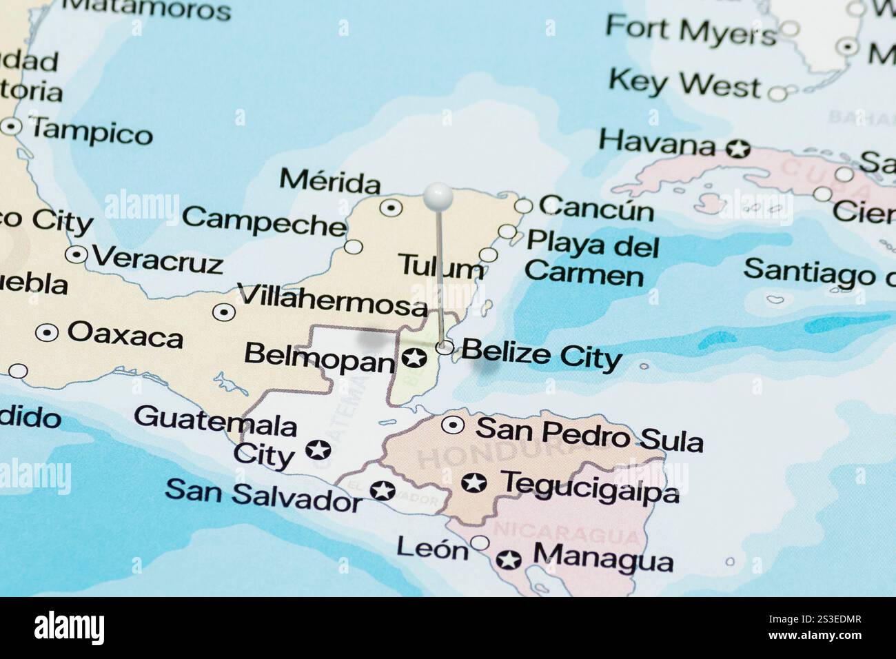 Macro photo of a white pin needle into Belize city of Belize political ...