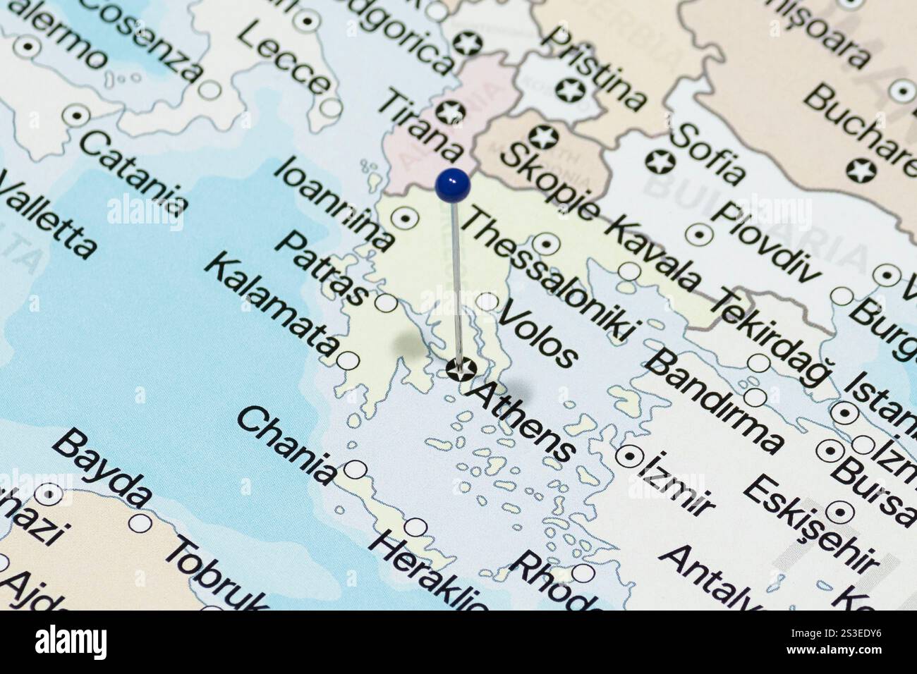 Macro photo of a blue pin needle into Athens city of Greece political ...