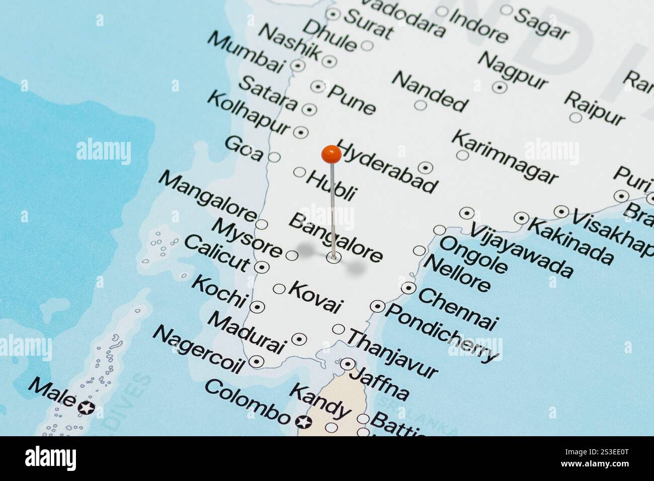 Macro photo of an orange pin needle into Bangalore city of India ...