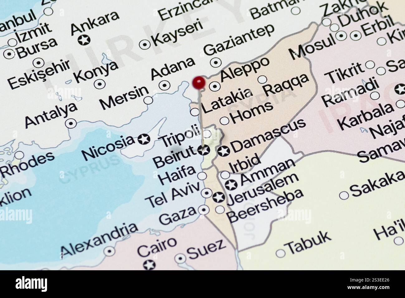 Macro photo of a red pin needle into Beirut city of Lebanon political ...