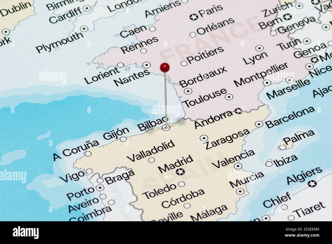 Macro photo of a red pin needle into Bilbao city of Spain political map ...