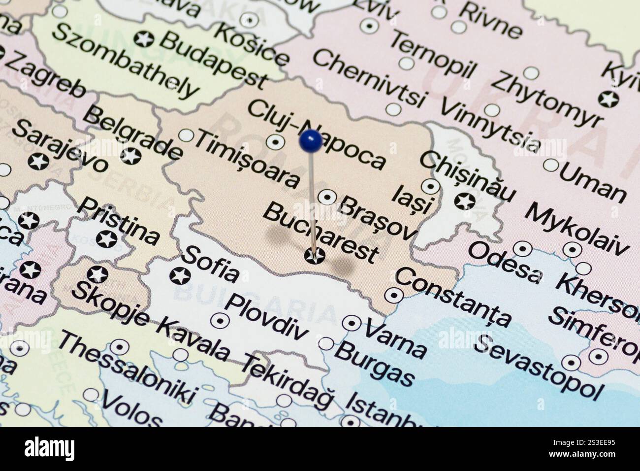 Macro photo of a blue pin needle into Bucharest city of Romania ...