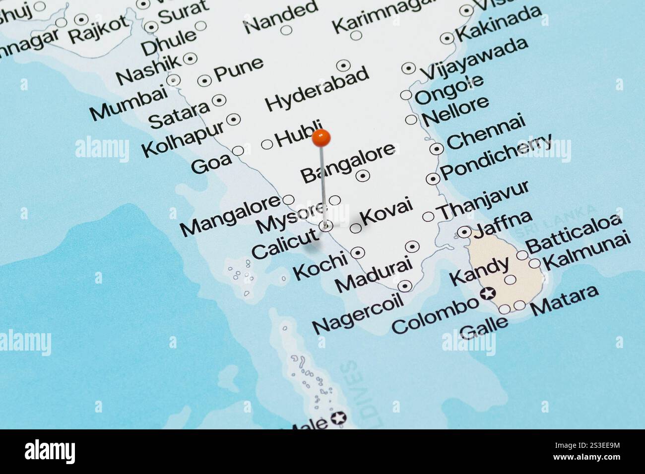 Macro photo of an orange pin needle into Calicut city of India ...