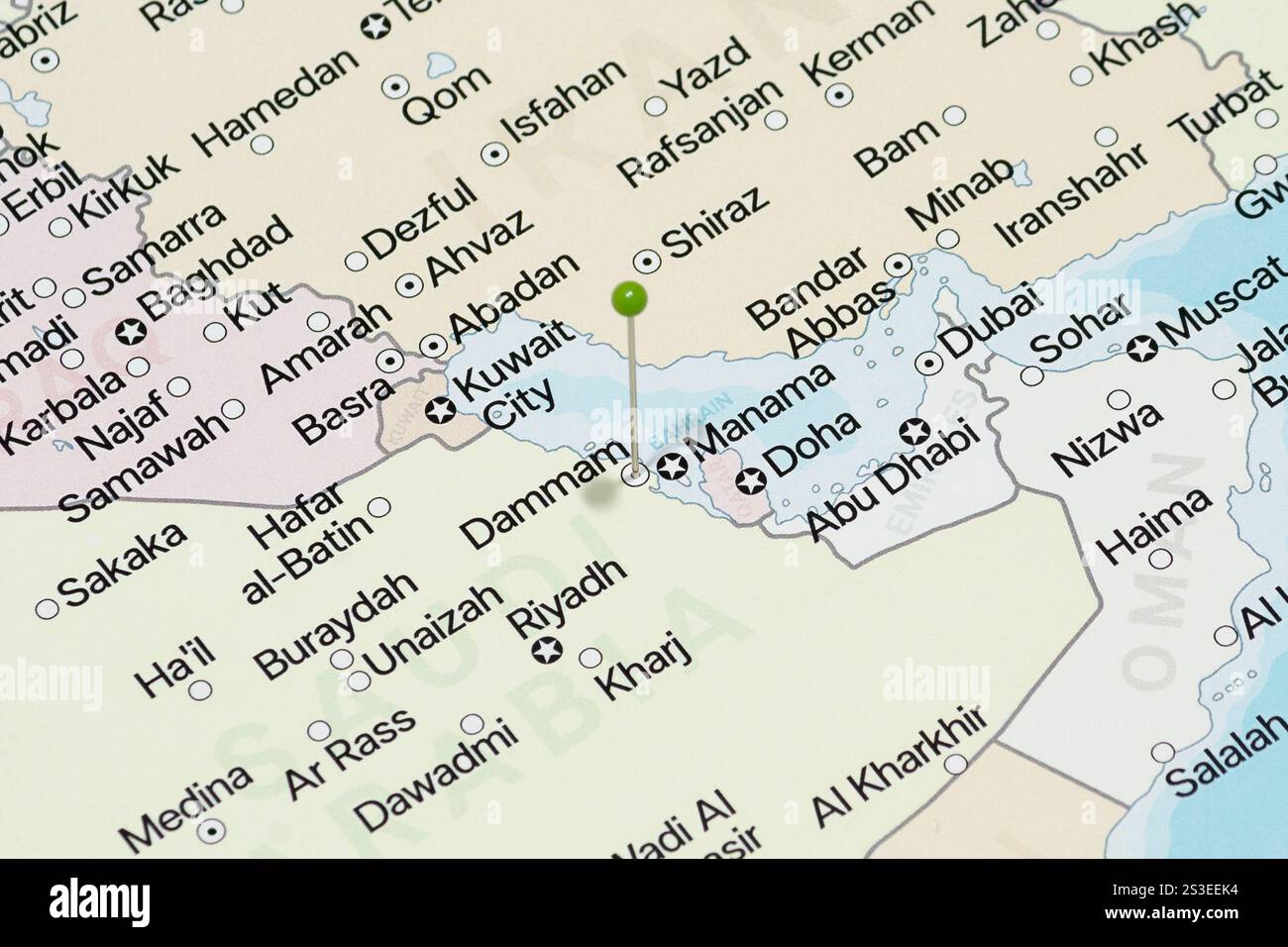 Macro photo of a green pin needle into Dammam city of Saudi Arabia ...