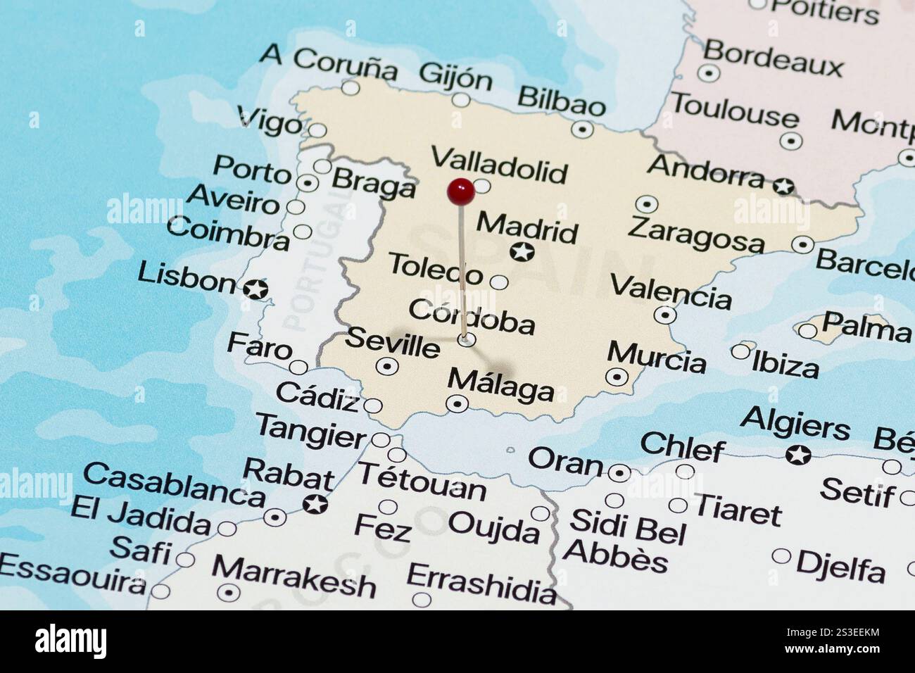 Macro photo of a red pin needle into Cordoba city of Spain political ...