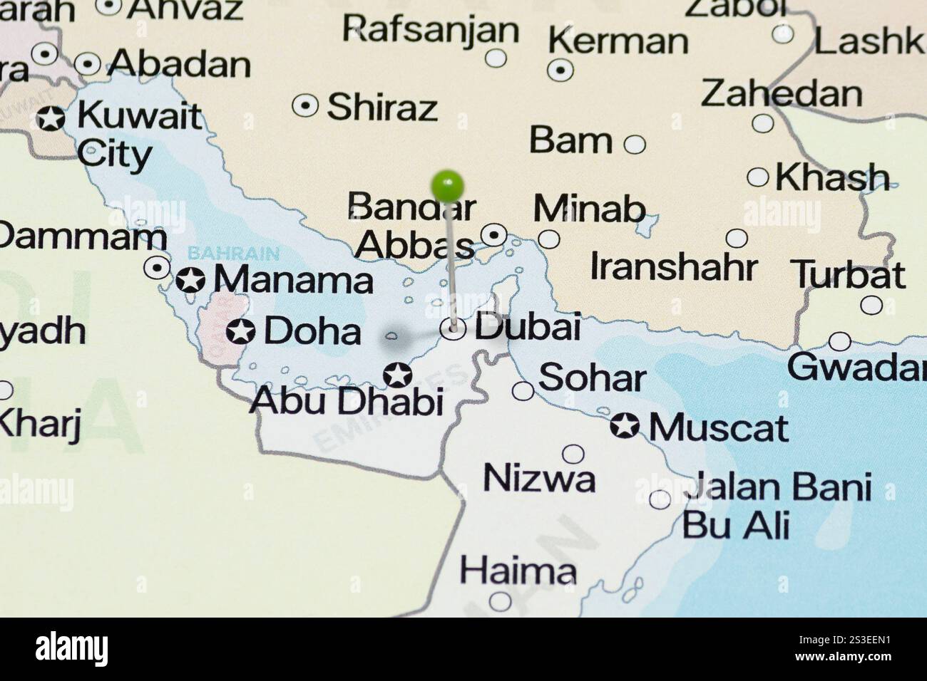 Macro photo of a green pin needle into Dubai city of United Arab ...