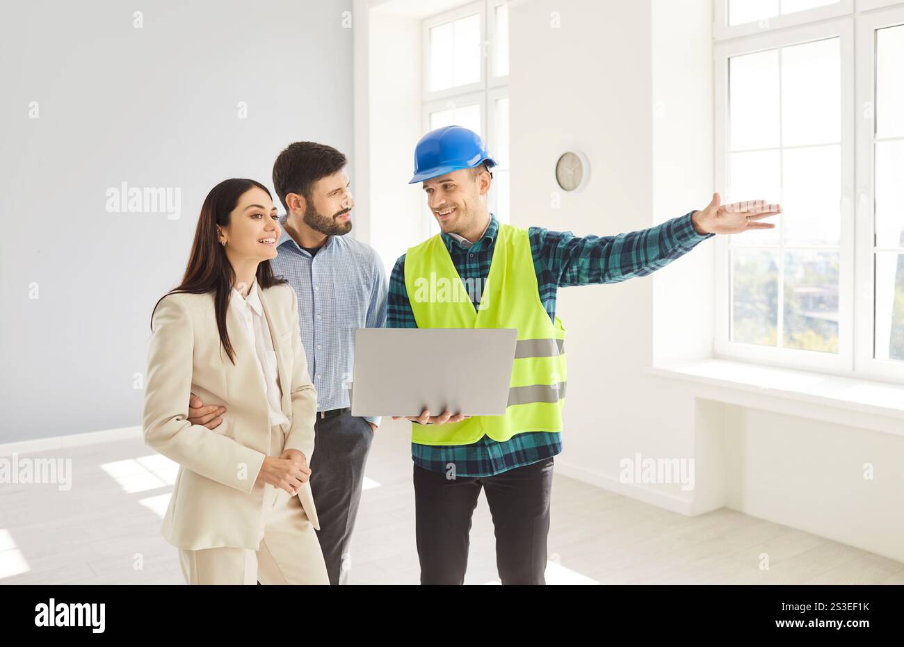 Builder Discussing Home Renovation Project With Husband And Wife Stock ...