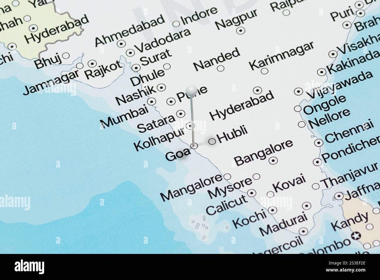 Macro photo of a white pin needle into Goa city of India political map ...