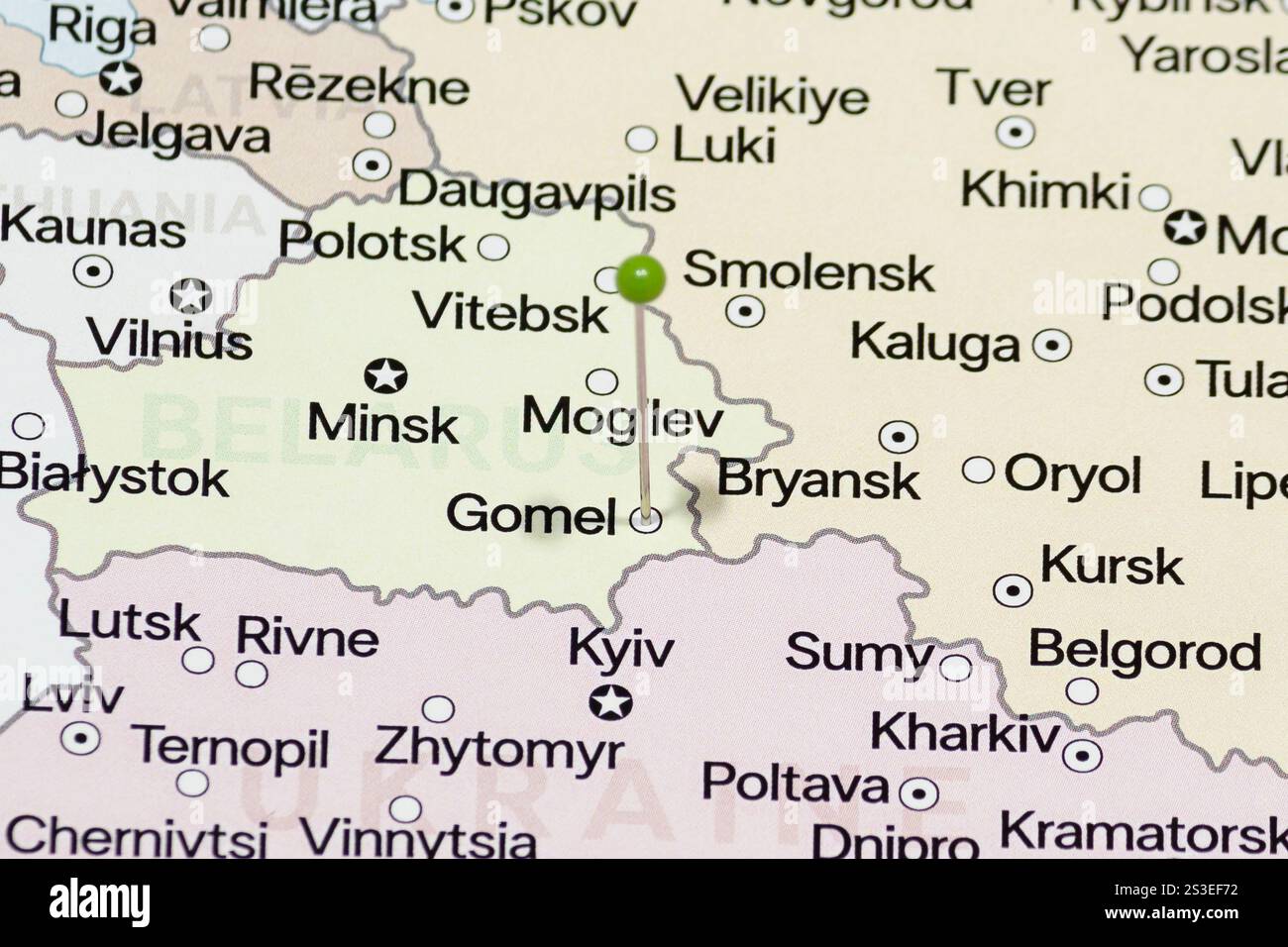 Macro photo of a green pin needle into Gomel city of Belarus political ...