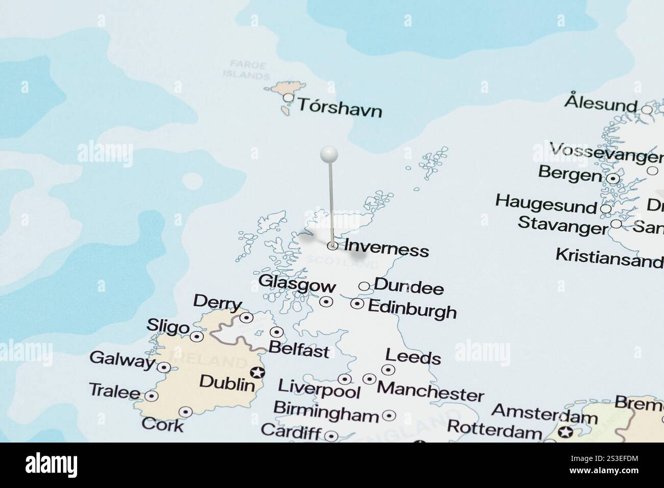 Macro photo of a white pin needle into Inverness city of Scotland ...