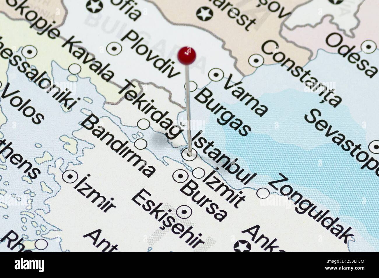 Macro photo of a red pin needle into Istanbul city of Turkey political ...