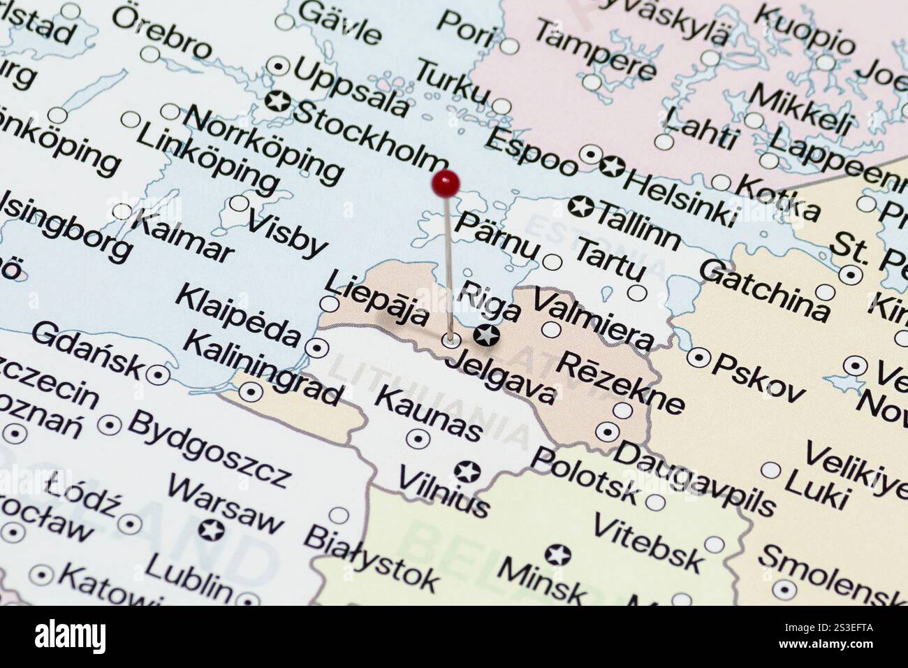 Macro photo of a red pin needle into Jelgava city of Latvia political ...