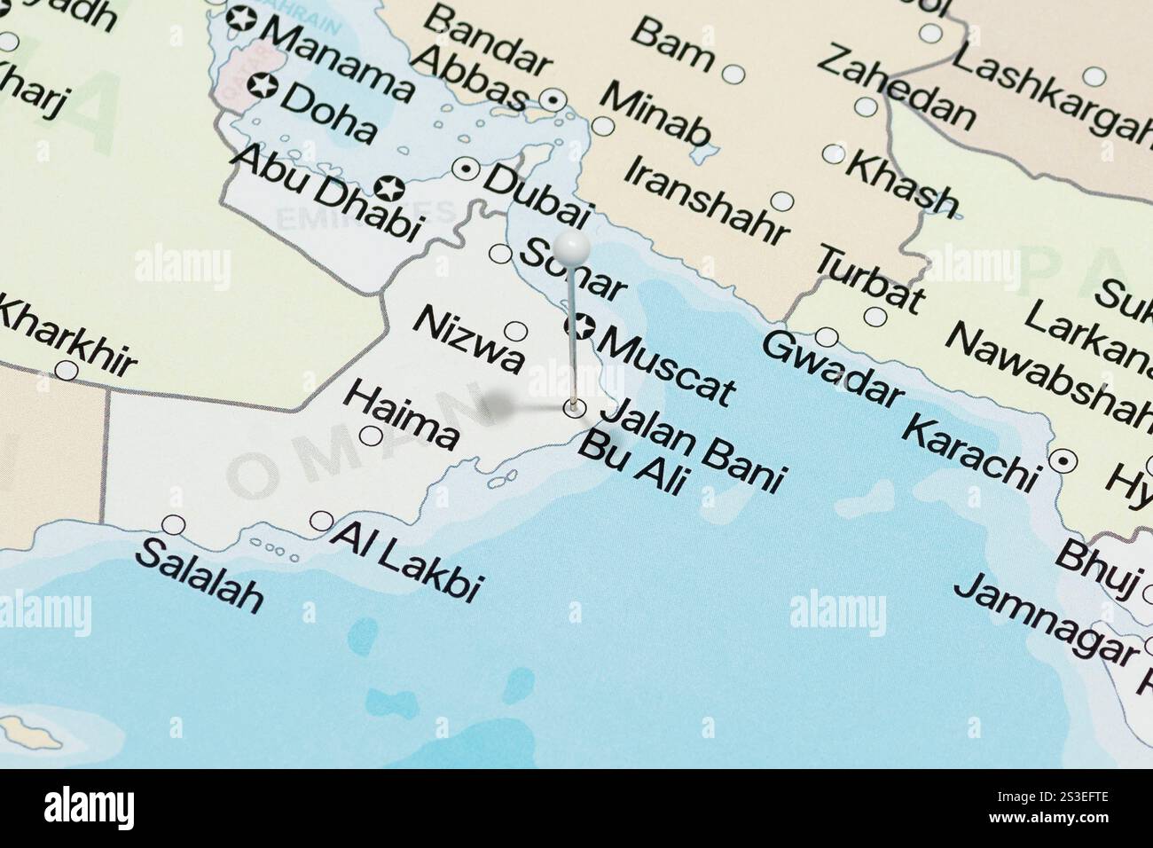 Macro photo of a white pin needle into Jalan Bani Bu Ali city of Oman ...