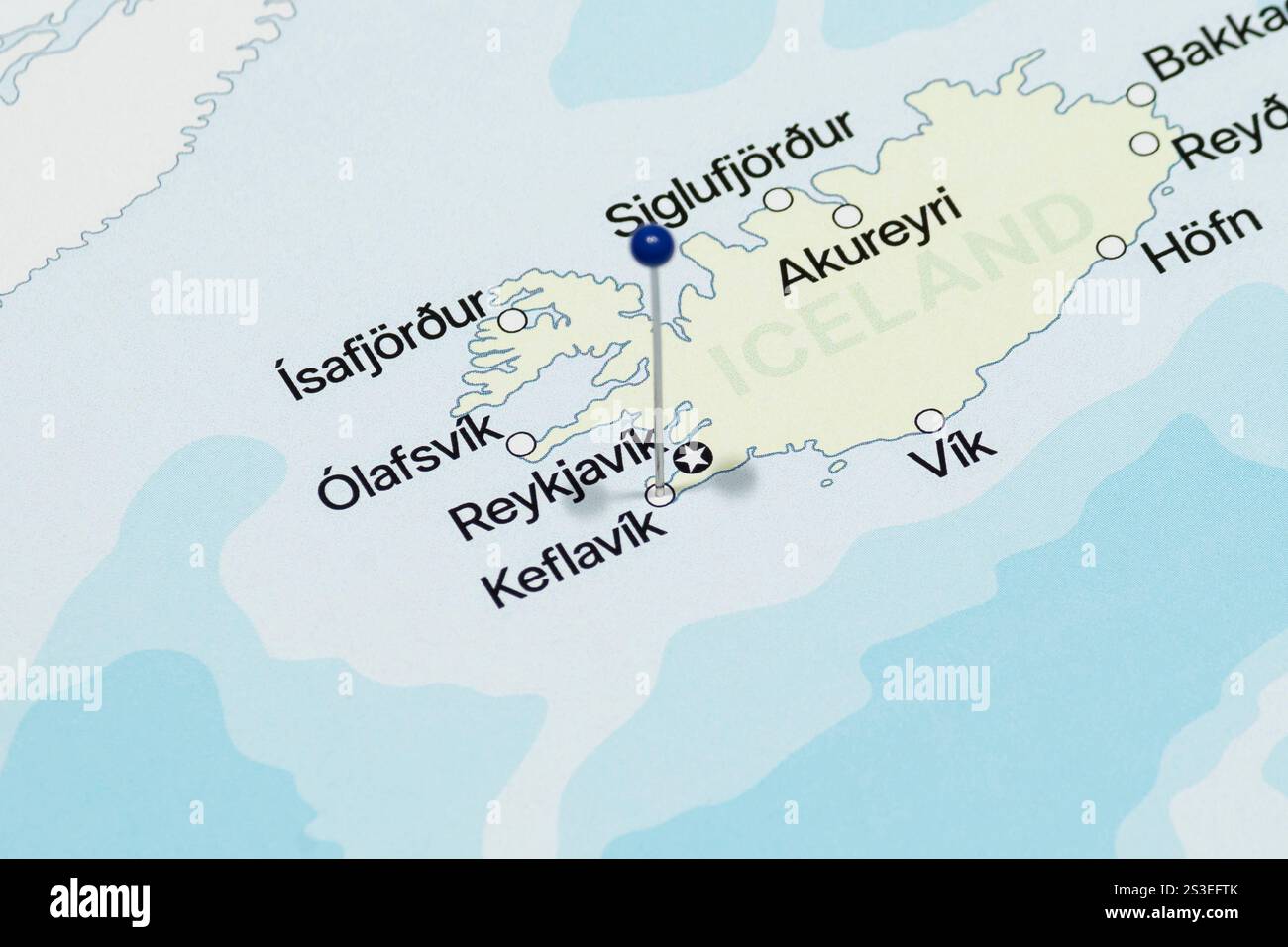 Macro photo of a blue pin needle into Keflavik city of Iceland ...