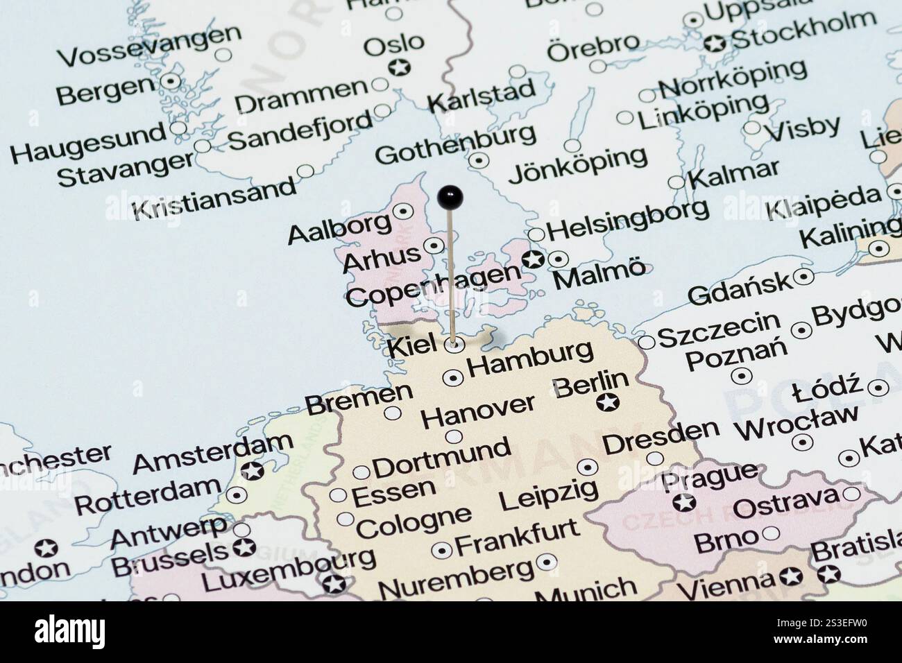 Macro photo of a black pin needle into Kiel city of Germany political ...