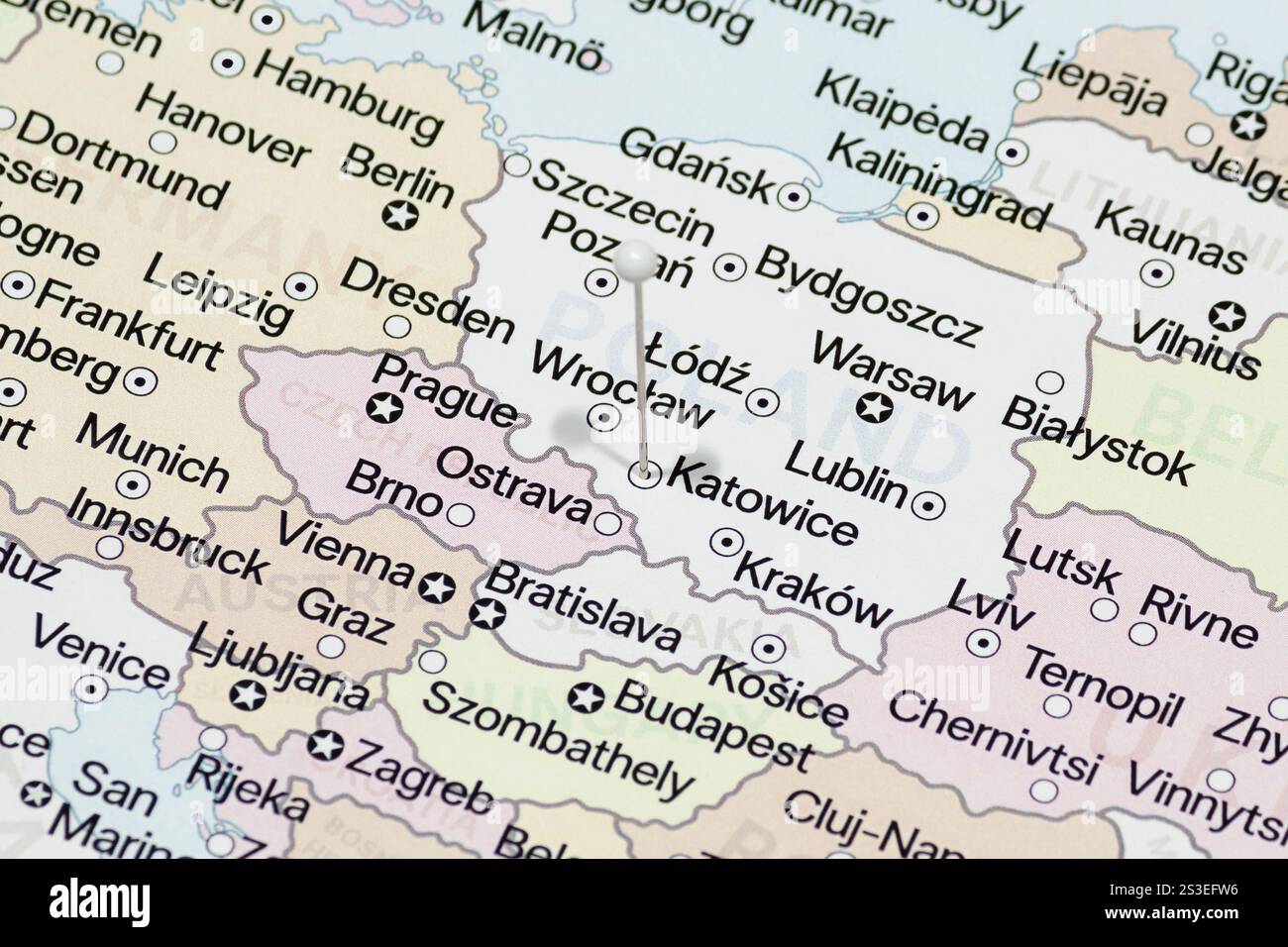 Macro photo of a white pin needle into Katowice city of Poland ...