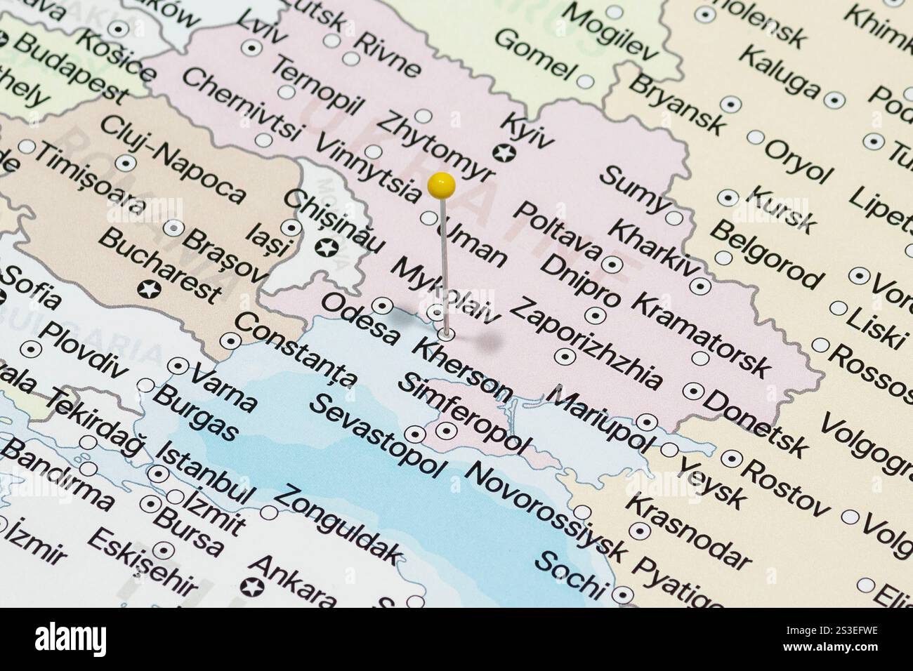 Macro photo of a yellow pin needle into Kherson city of Ukraine ...