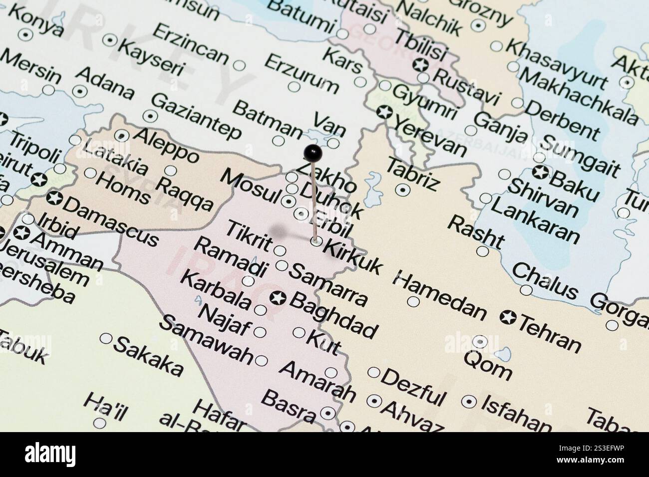 Macro photo of a black pin needle into Kirkuk city of Iraq political ...