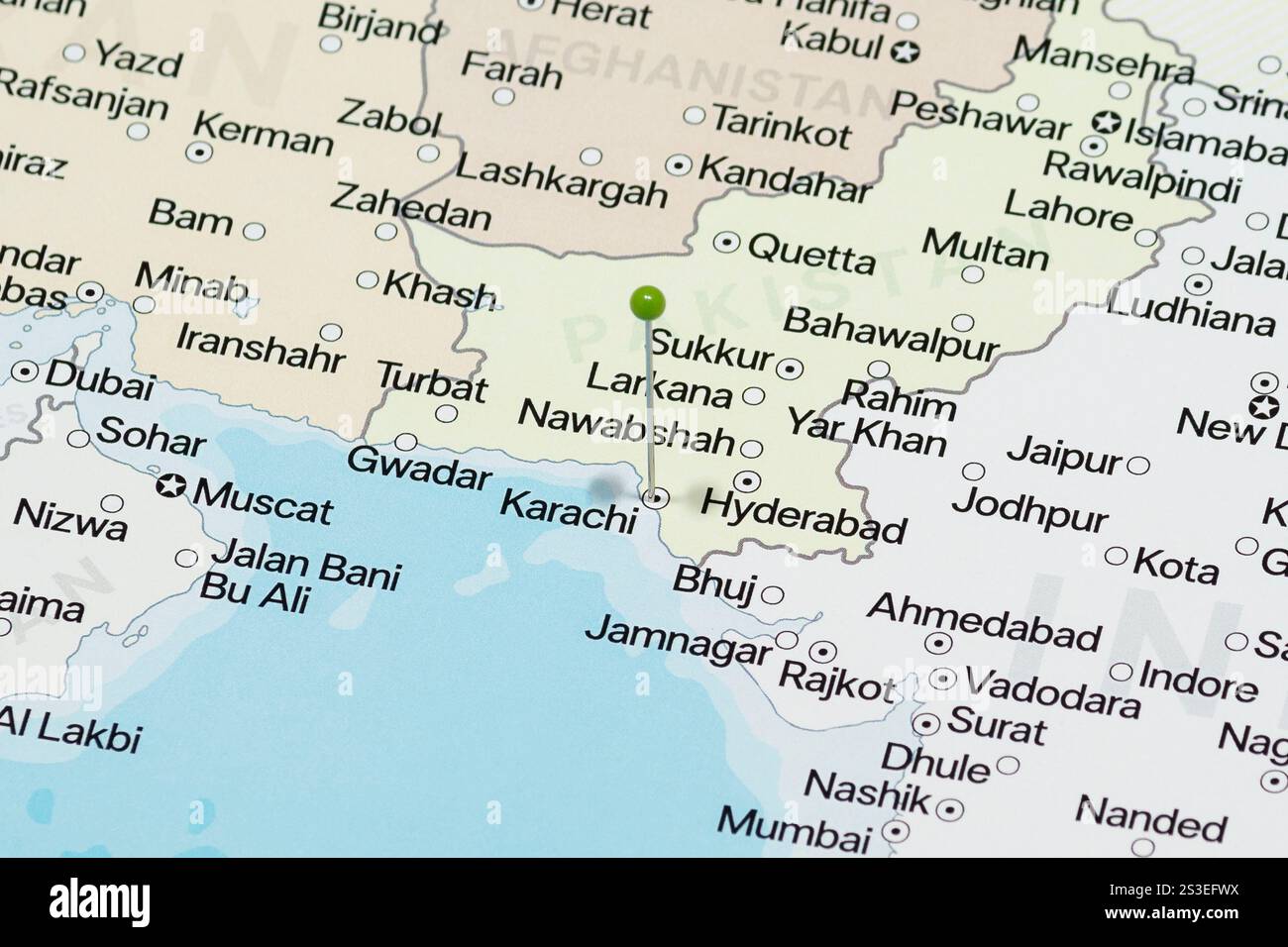 Macro photo of a green pin needle into Karachi city of Pakistan ...