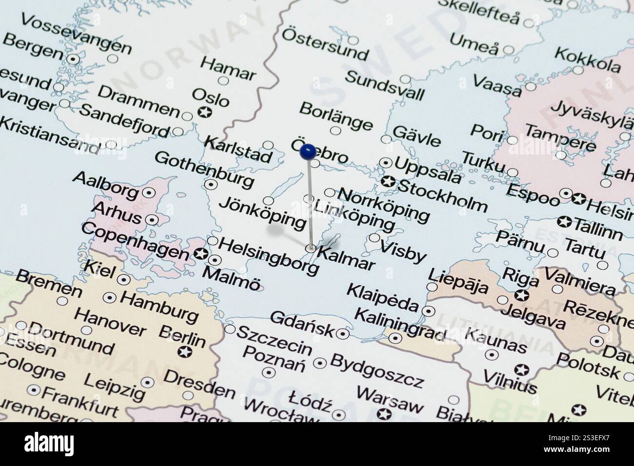 Macro photo of a blue pin needle into Kalmar city of Sweden political ...