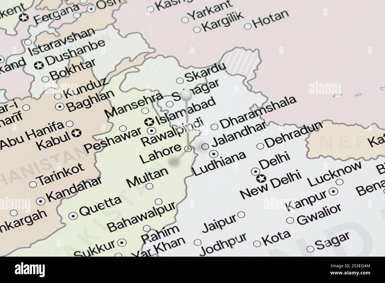 Macro photo of a white pin needle into Lahore city of Pakistan ...