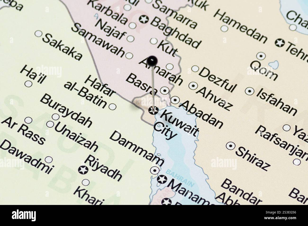 Macro photo of a black pin needle into Kuwait city of State of Kuwait ...